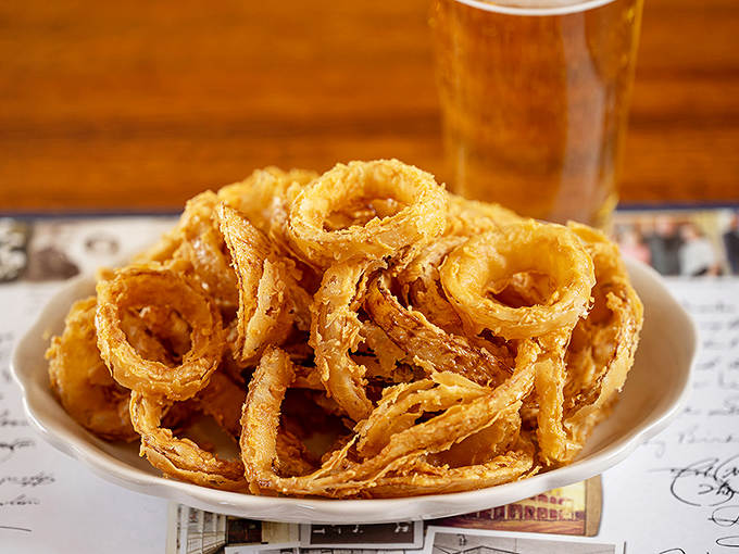 These aren't just onion rings &ndash; they're crispy halos of happiness, served with a side of nostalgia and pure joy.