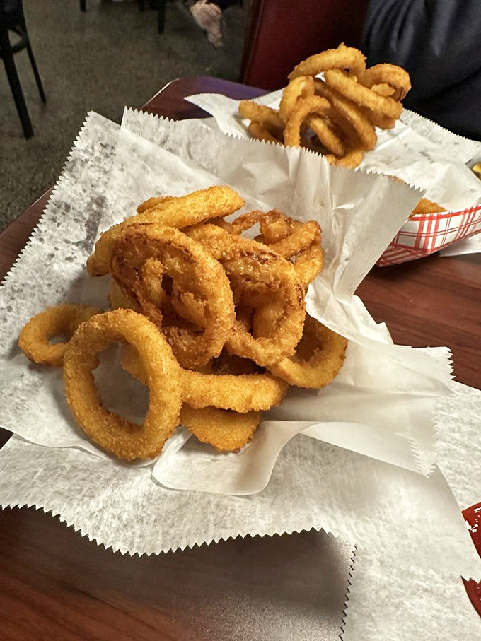 These aren't just any onion rings. They're Miller's legendary golden hoops with substantial, crunchy batter that shatters with each satisfying bite.