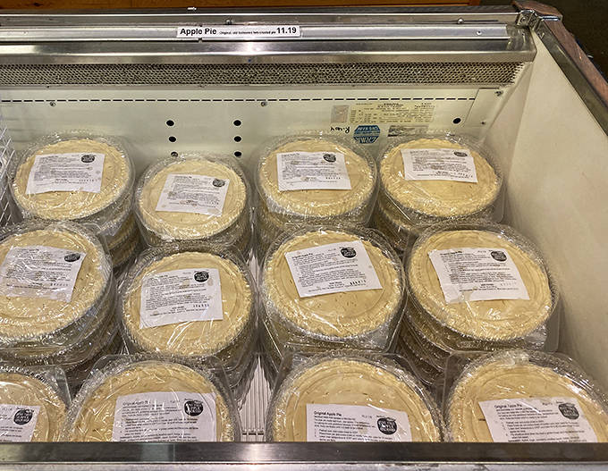 The freezer case holds rows of take-and-bake pies, each one promising to transform your kitchen into the best-smelling spot in the neighborhood.