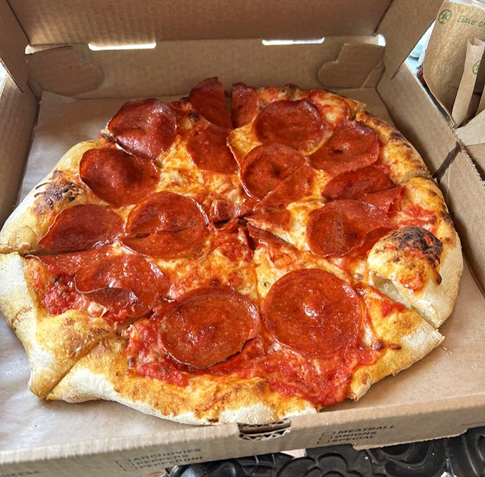 Pepperoni Pizza: Not your average pepperoni pie – these perfectly curled cups cradle their own savory oils atop a blistered, chewy crust.