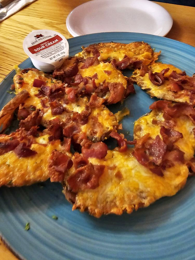 Potato pancakes with bacon and cheese? This isn't diet food, folks &ndash; it's happiness on a blue plate.