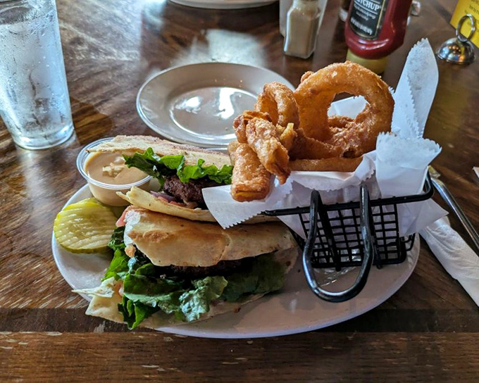 This burger and onion ring combo isn't just lunch &ndash; it's a monument to comfort food done right, with hand-cut rings that shatter perfectly with each bite.