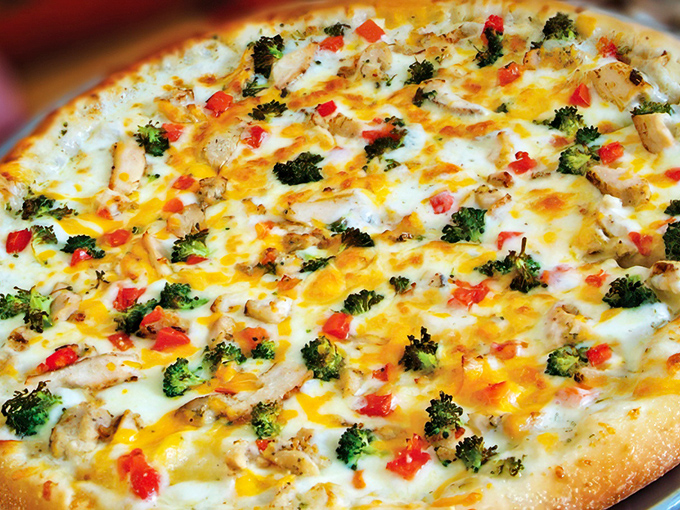 The Sarge Pizza combines fresh vegetables with perfectly melted cheese – proof that sometimes simplicity delivers the most satisfying flavors.