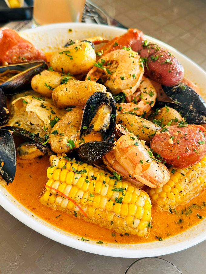 Seafood boil: A glorious medley where shrimp, mussels, and sausage play together in a spicy broth that'll make your taste buds dance.