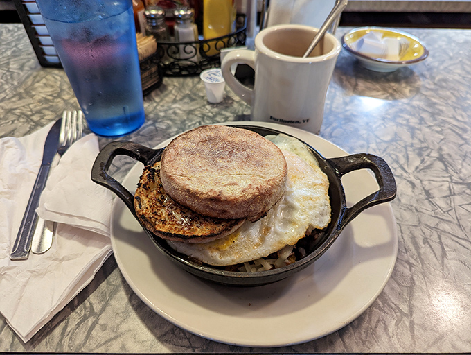 Cast iron magic happening before your eyes&mdash;a sizzling English muffin sandwich that's about to make someone's morning infinitely better.