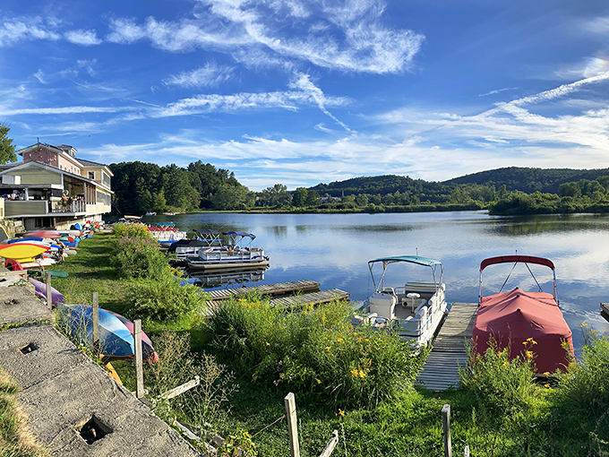Boats bob along the marina like colorful punctuation marks on the river's sentence, inviting lazy summer days spent floating instead of rushing through life's endless to-do lists.