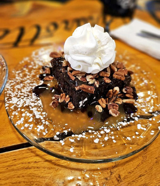 The Turtle Pecan Brownie arrives like a chocolate revelation &ndash; warm, dense cake crowned with whipped cream and pecans swimming in caramel.