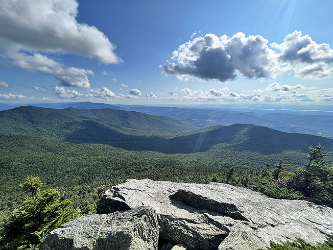 The reward for your burning thighs and labored breathing: Vermont's landscape unfurling like a living topographic map.