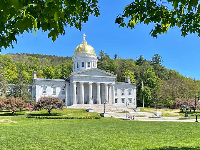 Vermont's State House stands proud with its golden dome gleaming like a beacon of democracy, proving that government buildings can actually be gorgeous.