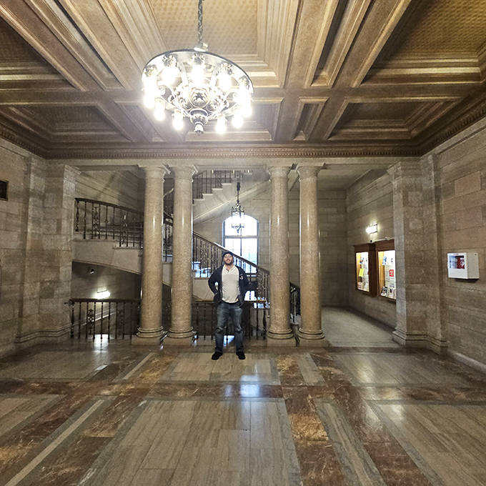 The grand marble staircase creates a dramatic focal point, where visitors can channel their inner scholar while navigating between floors.
