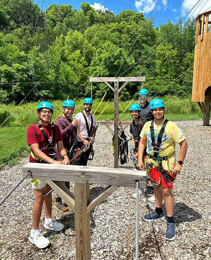Geared up and ready for action, these smiling adventurers showcase the camaraderie that comes with conquering heights together.