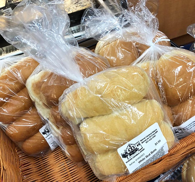 These pillowy white buns understand their mission: support your bratwurst without falling apart like those wimpy imposters that surrender at the first sign of sauerkraut.