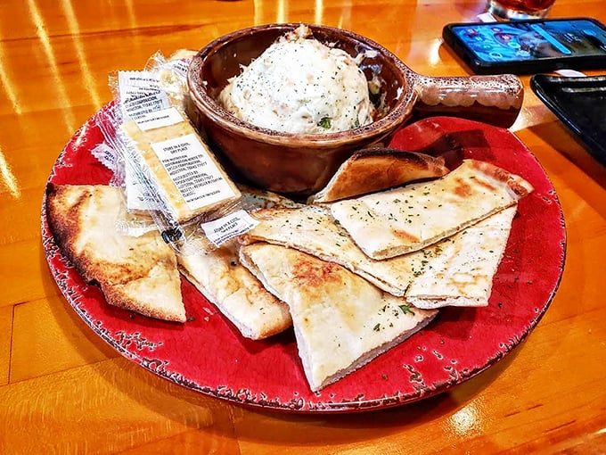 Creamy whitefish dip served with warm flatbread &ndash; locally caught fish transformed into a spread so good you'll contemplate licking the bowl.