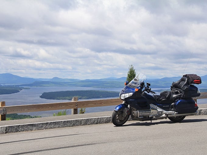 A motorcycle pauses at the overlook &ndash; even the most seasoned riders can't resist this view's magnetic pull.