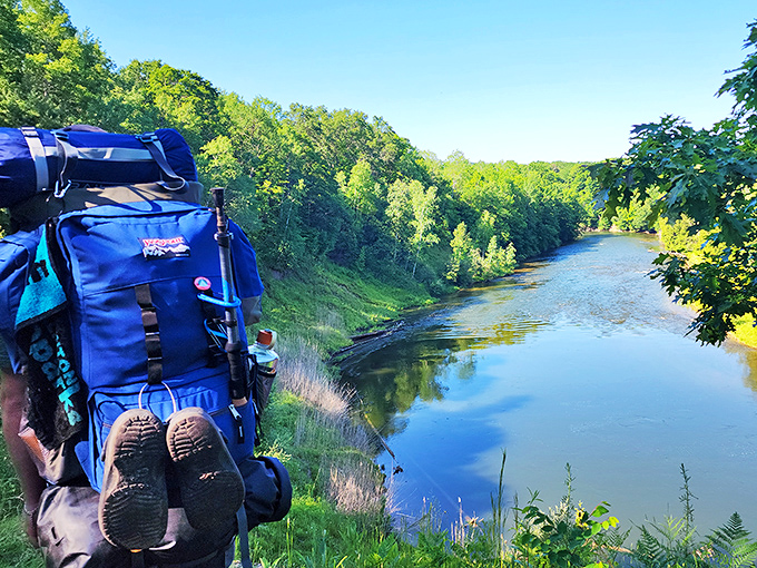 Nothing says "I conquered nature" quite like dangling your tired hiking boots over a river that's been carving this landscape for millennia.
