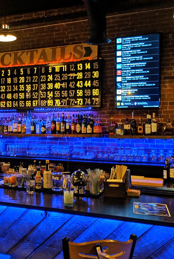 The bar area balances retro charm with modern mixology, where numbered cocktail options line up like high scores waiting to be claimed.