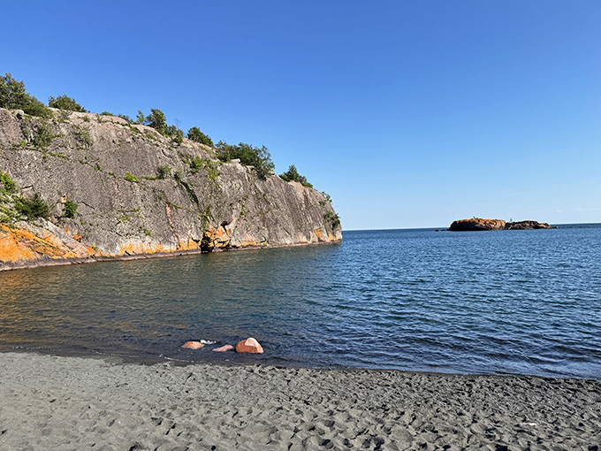 The protected cove offers a more intimate beach experience than the sprawling shores found elsewhere along Minnesota's North Shore.