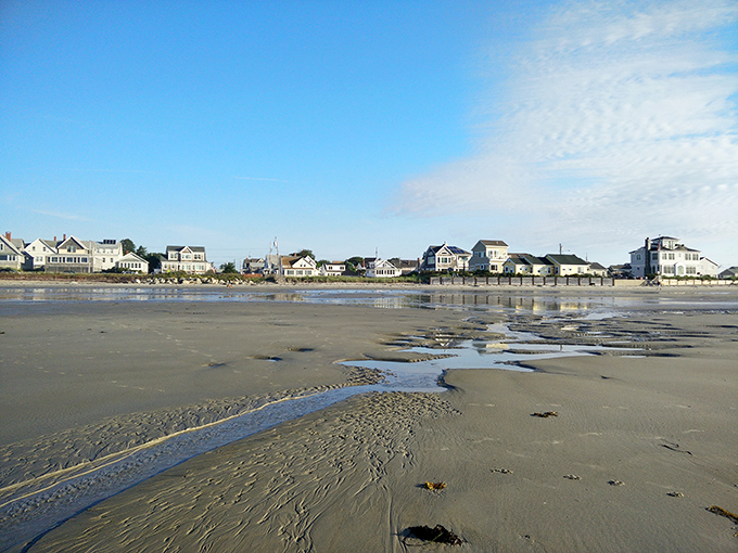 Beachfront homes stand sentinel along the shore, their weathered shingles bearing witness to countless tides and spectacular sunrises.