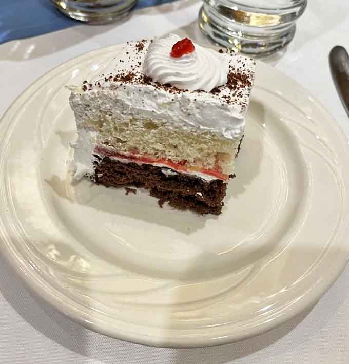 This isn't just cake - it's an architectural achievement with perfect layers of chocolate, cream, and fruit that would impress German engineers.