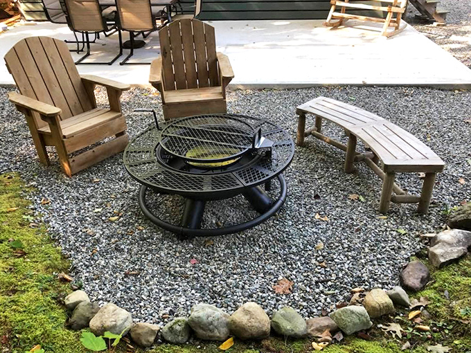 Adirondack chairs circle a well-designed fire pit, where strangers become friends and marshmallows meet their delicious destiny.