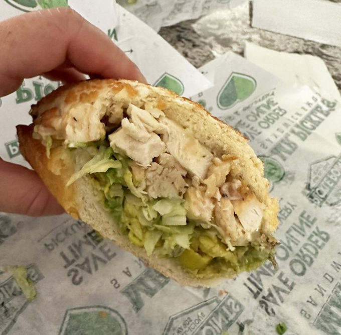 A chicken sandwich so tender and perfectly constructed, it makes you wonder if architecture schools should study sandwich engineering.