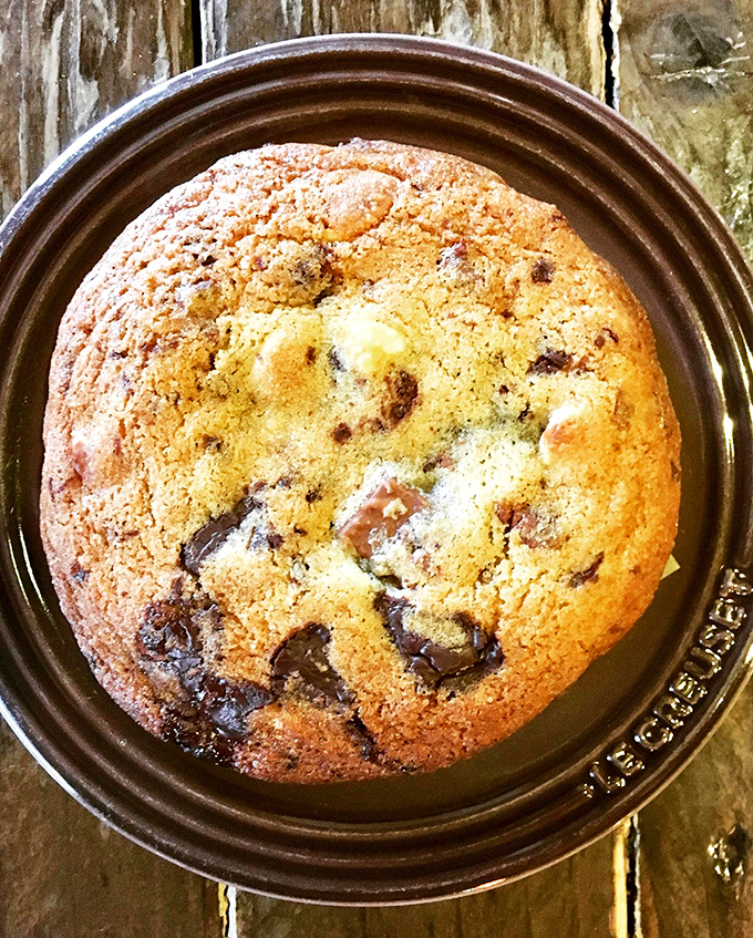 This chocolate chip cookie isn't just dessert—it's a commitment to happiness, with melty pockets of chocolate demanding your full attention.