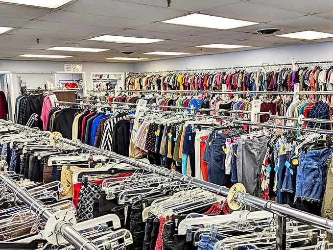 Racks of clothing stretch into the distance like a fabric rainbow, offering second chances to garments that still have plenty of style left to give.