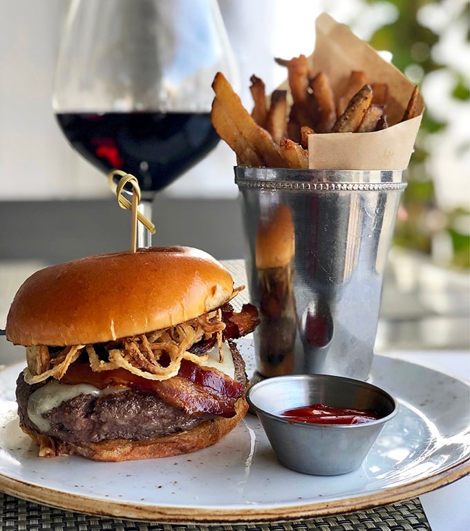Not just any burger &ndash; this masterpiece combines premium beef, melted cheese, and crispy bacon with house-made fries that'll ruin you for all others.