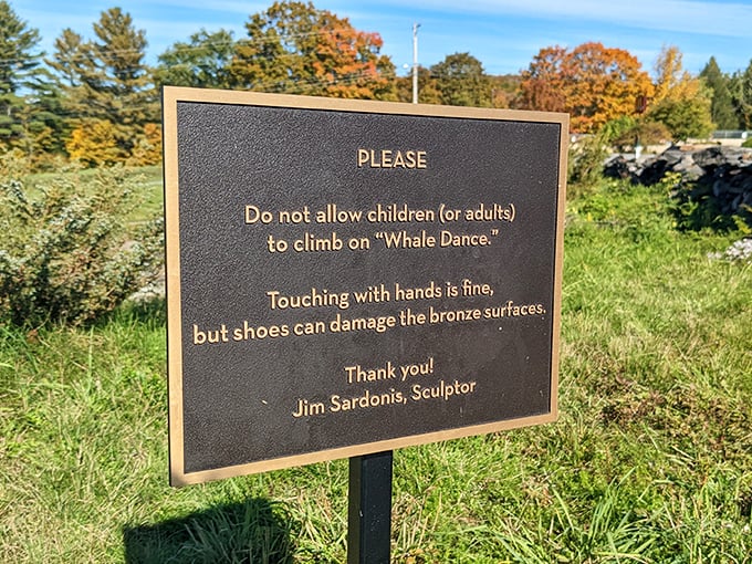 The sculptor's warning sign adds a touch of practicality to this whimsical installation&mdash;touch with hands, not feet!