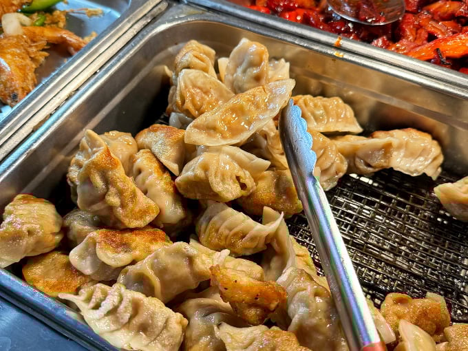 These pan-fried dumplings, with their perfectly crisp bottoms and tender tops, might be worth the trip alone.