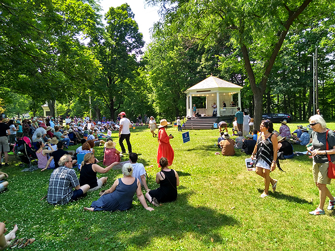 The town green comes alive during summer events, where locals spread blankets, children play, and music fills the air.
