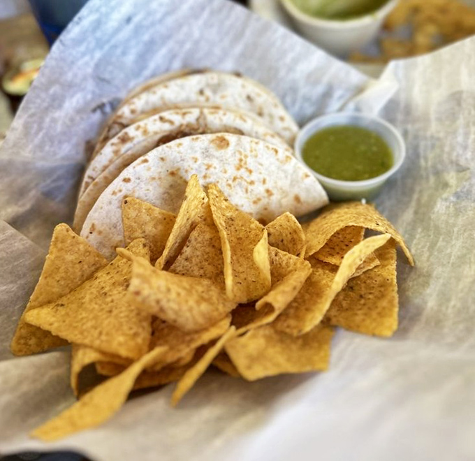 Crispy tortilla chips surround soft, warm quesadillas – it's the textural tango your taste buds have been waiting for.