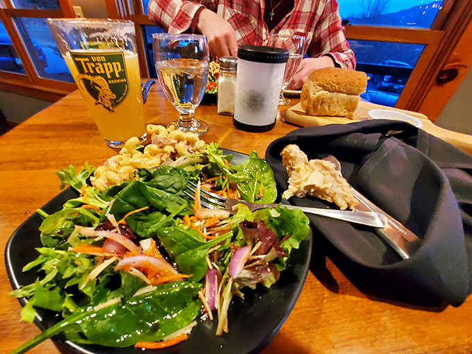 Fresh greens, vibrant dressing, and a table that invites lingering conversations. This salad bar puts sad airport lettuce to shame.