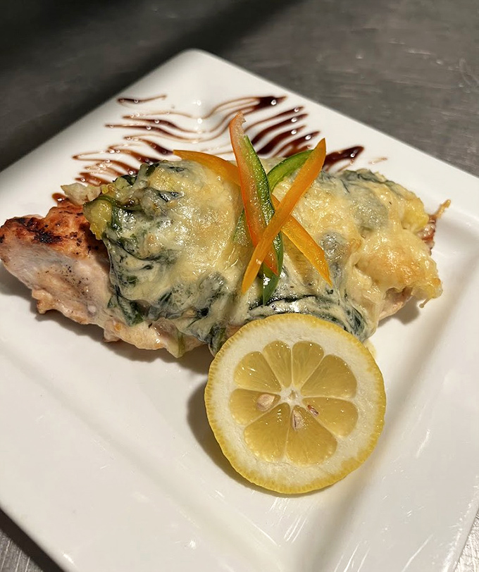 This salmon dish isn't just dinner &ndash; it's artwork on a plate, with spinach cream sauce that would make even vegetables skeptical people reconsider.