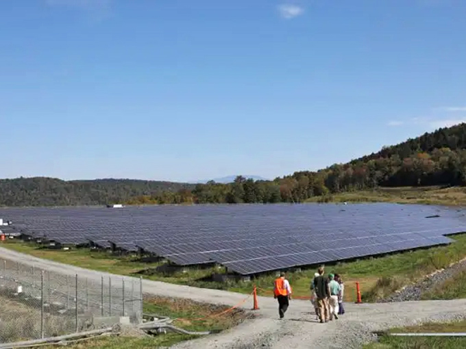 Solar panels stretch across the hillside where miners once toiled, turning a former environmental problem into clean energy, because redemption stories aren't just for people, they're for landscapes too.