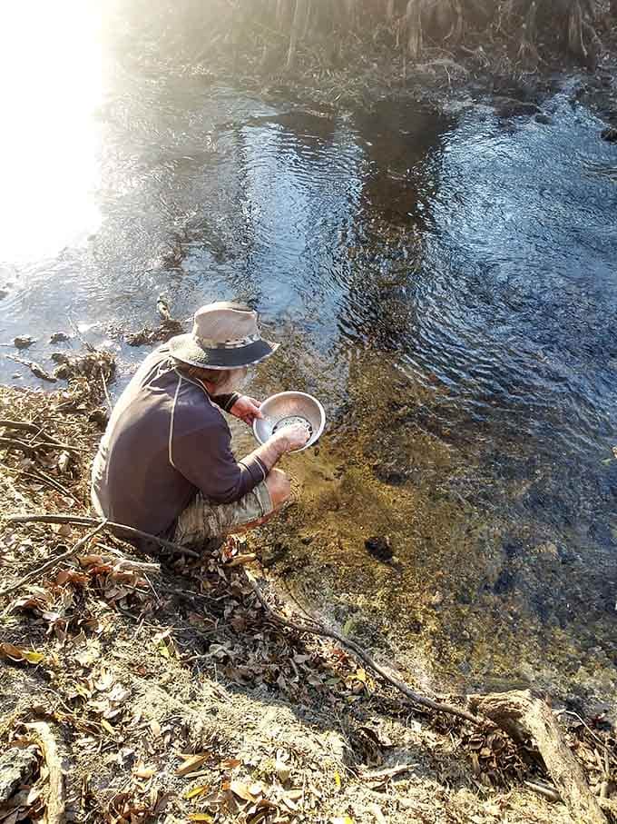 Armed with a sieve and determination, this fossil hunter demonstrates the simple technique that yields prehistoric treasures.