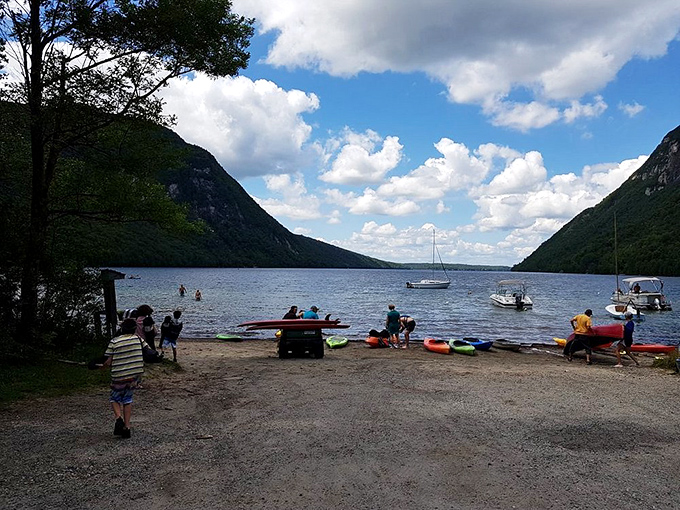 Beach day at Lake Willoughby means sandy shores, mountain views, and water cold enough to make you question all your life choices simultaneously.