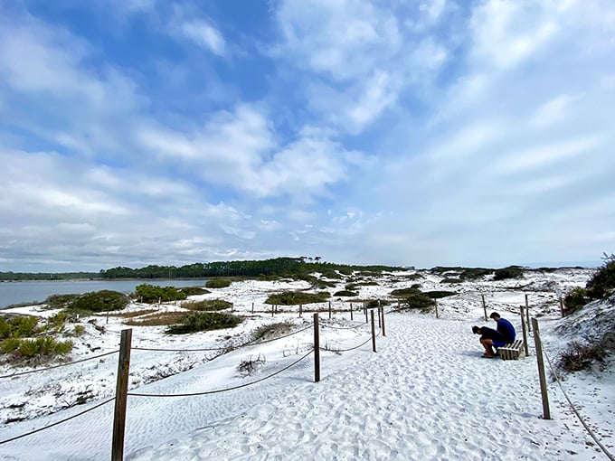 Dune wonderland: Protected walkways guide visitors through Grayton's fragile ecosystem, where each sandy ridge tells an ancient coastal story.