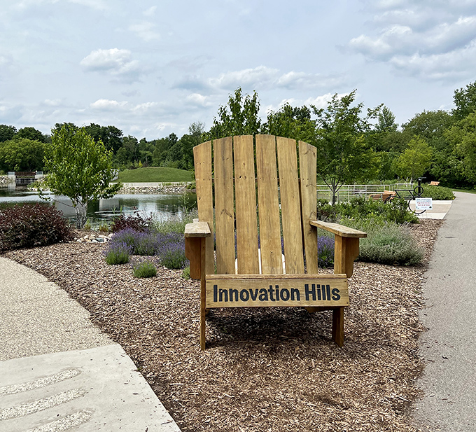 Take a moment to breathe in the oversized Adirondack chair, Innovation Hills' invitation to slow down and soak in Michigan's natural beauty.
