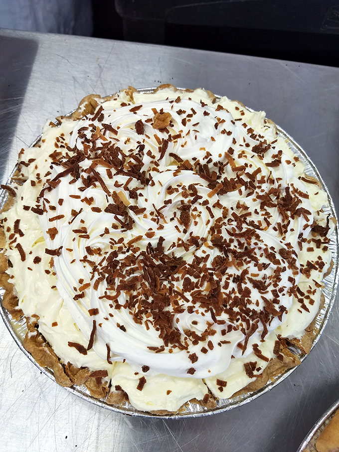 Coconut cream pie that's worth the drive &ndash; pillowy filling topped with fresh whipped cream and toasted coconut shavings for textural bliss.