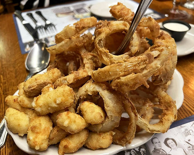 Comfort food elevated to art form&mdash;golden onion rings and cheese curds that would make Wisconsin proud.