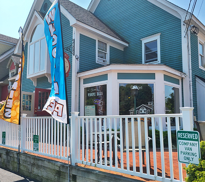 Auntie's House Bakery's charming teal Victorian building looks like it belongs in a storybook. The white porch railing and colorful flags beckon dessert lovers.