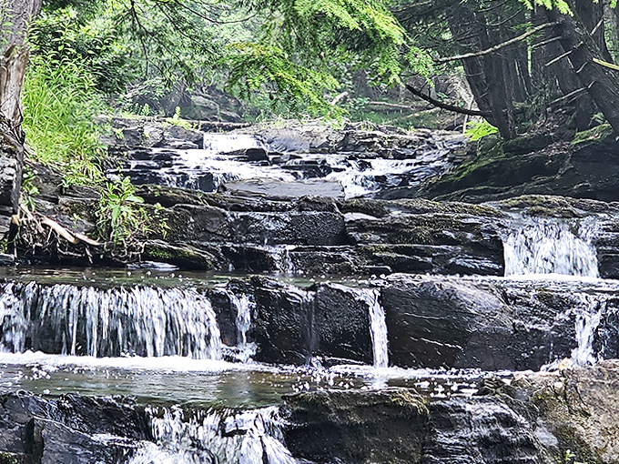 Black River Falls plays a game of hide-and-seek with visitors, revealing its multi-tiered cascades only to those who seek it out.