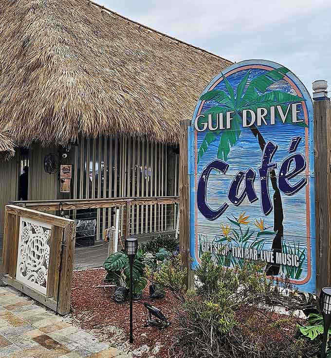 That thatched roof and beachy sign promise good food and even better views just steps from the shore.
