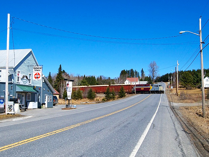 A classic Maine general store stands beside empty country roads in Masardis, where passing trains still connect to the outside world.
