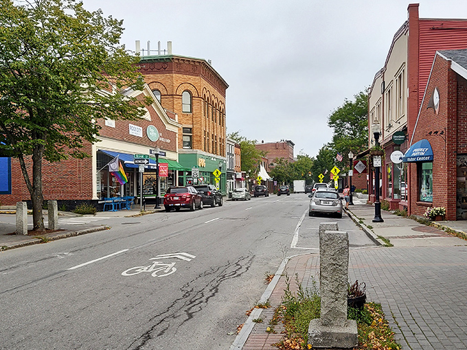 Rockland's public landing welcomes visitors with American flags fluttering against a backdrop of blue harbor waters and historic buildings.