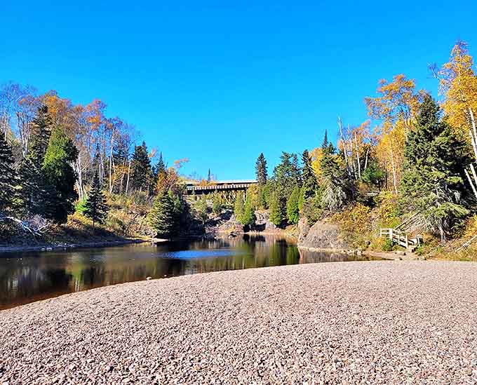 Tettegouche's rugged hiking trails reward adventurers with peaceful reflections in crystal-clear waters surrounded by Minnesota's northern forest.