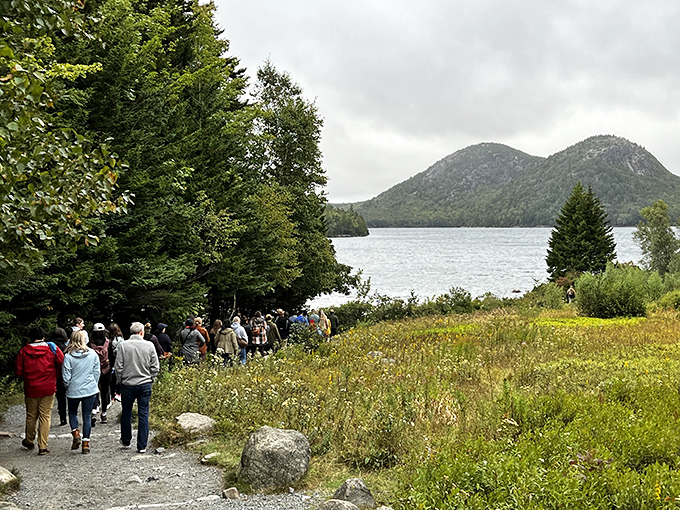 "Those folks are definitely flatlandahs!" They're all stopping to admire our beautiful Maine mountains and lakes! Enjoy the view, everyone!