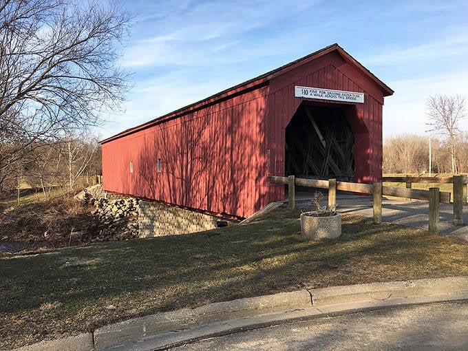 The historic Zumbrota Covered Bridge stands proudly in red against the Minnesota landscape &ndash; the last of its kind in the state.