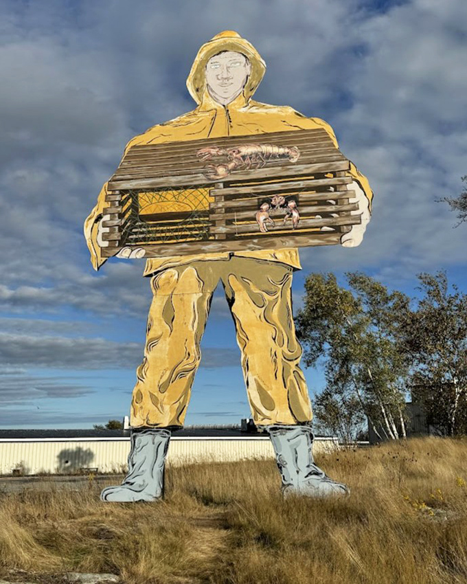 Dressed in traditional yellow fisherman's gear and proudly displaying his lobster trap, Big Jim has become Prospect Harbor's most photographed resident.